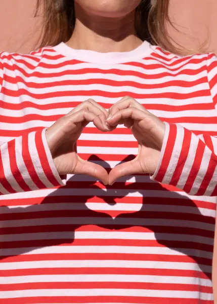 Female hands making sign Heart by fingers. Beautiful hands of woman ...