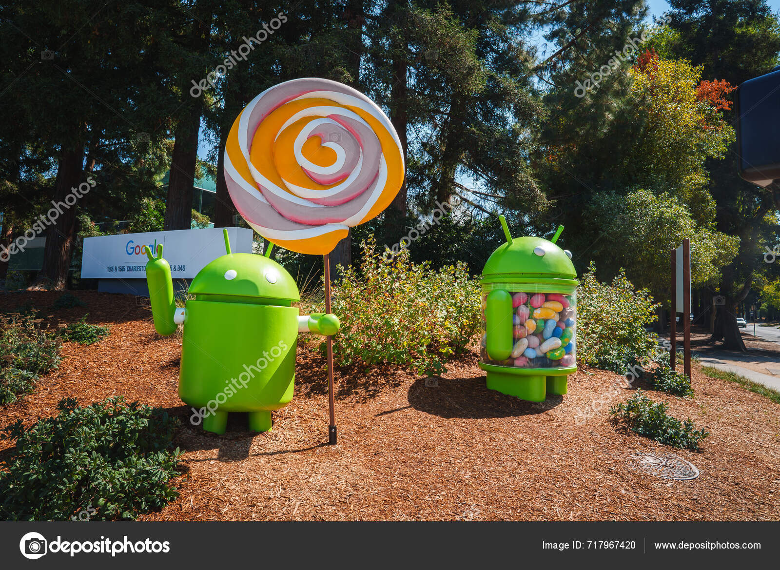 Two Playful Android Mascot Statues One Giant Lollipop Other Filled ...