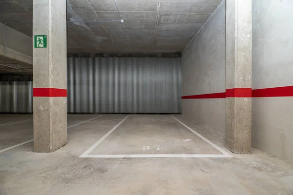 Parking spaces of a residential building with concrete walls and the ...
