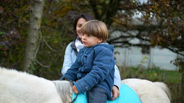 Child on pony Stock Photos, Royalty Free Child on pony Images ...