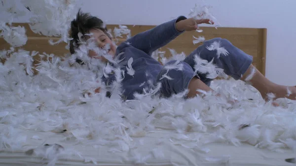 Happy Little Girl Falling Bed Thousands Feathers Flying Air Captured ...