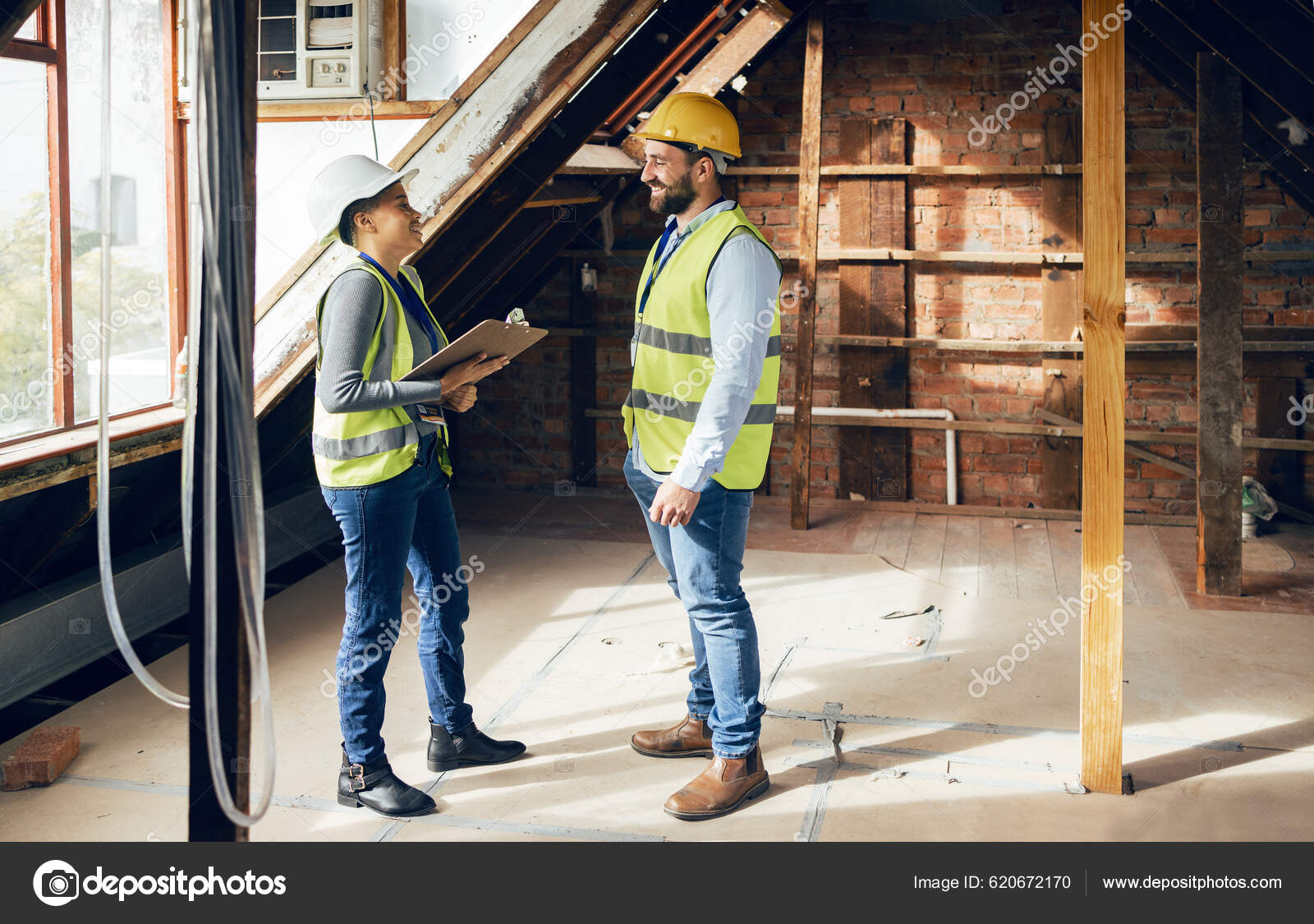Construction Workers Working On A House