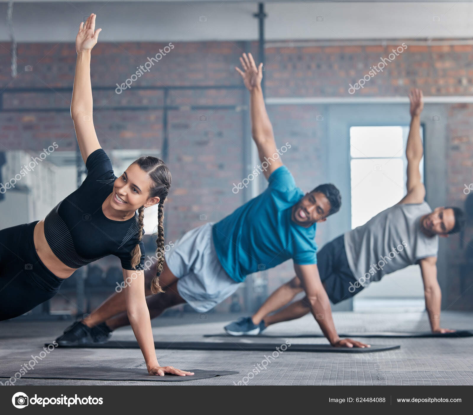 People Stretching At Gym