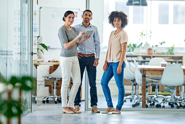 This office is full of positive vibes. Portrait of a diverse group of ...