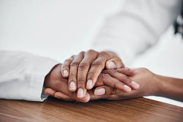 Help, hand and doctor with patient for cancer, bad news or diagnosis ...