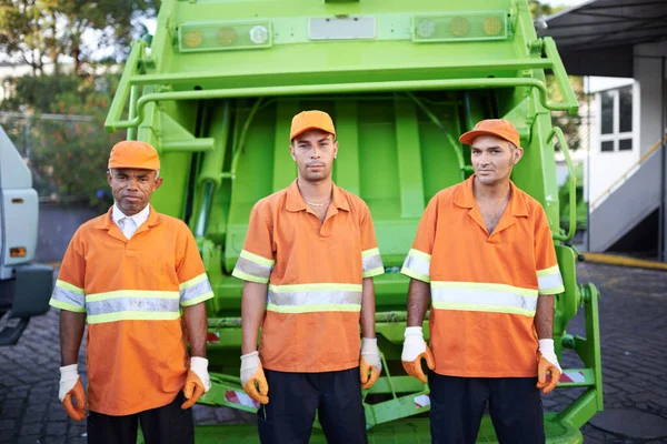 Garbage collection- the men who make it happen. Cropped portrait of a ...