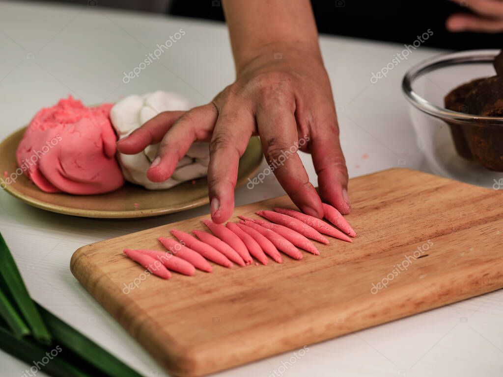 Woman Put Raw Red and White (Merah Putih) Cenil, Jajanan Pasar or ...