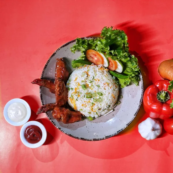 Fire-Wing fried Rice Bowl with mayo dip served in dish top view of ...