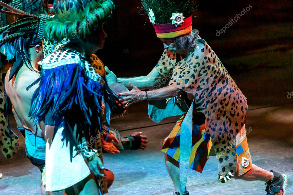 Xcaret, Mexico - January 25 2023: Mayan citizens fight in a pre-Hispanic dance at Xcaret in the ...