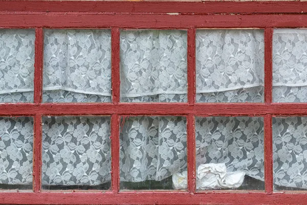 Old window in the house.Large window with wooden frames in the village ...