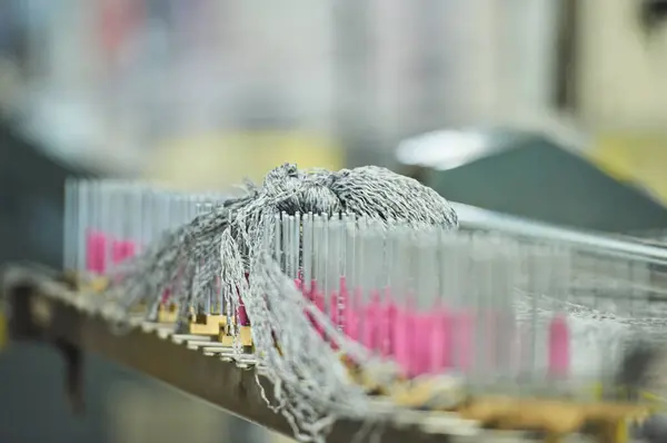 Cotton threads in industrial cotton in a weaving factory, machine ...