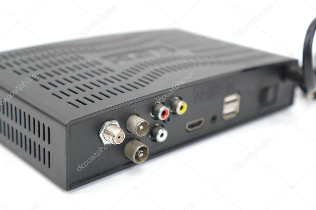 The image shows the connection ports on the back of a retro digital ...