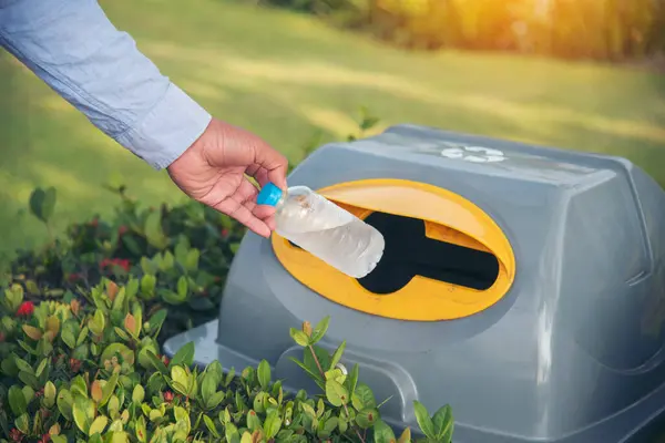 Men hands trow Trash cans for sorting garbage recycle bin waste plastic ...