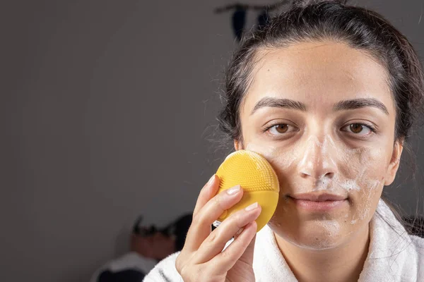 Cleaning make up, close up portrait of millennial woman cleaning make ...