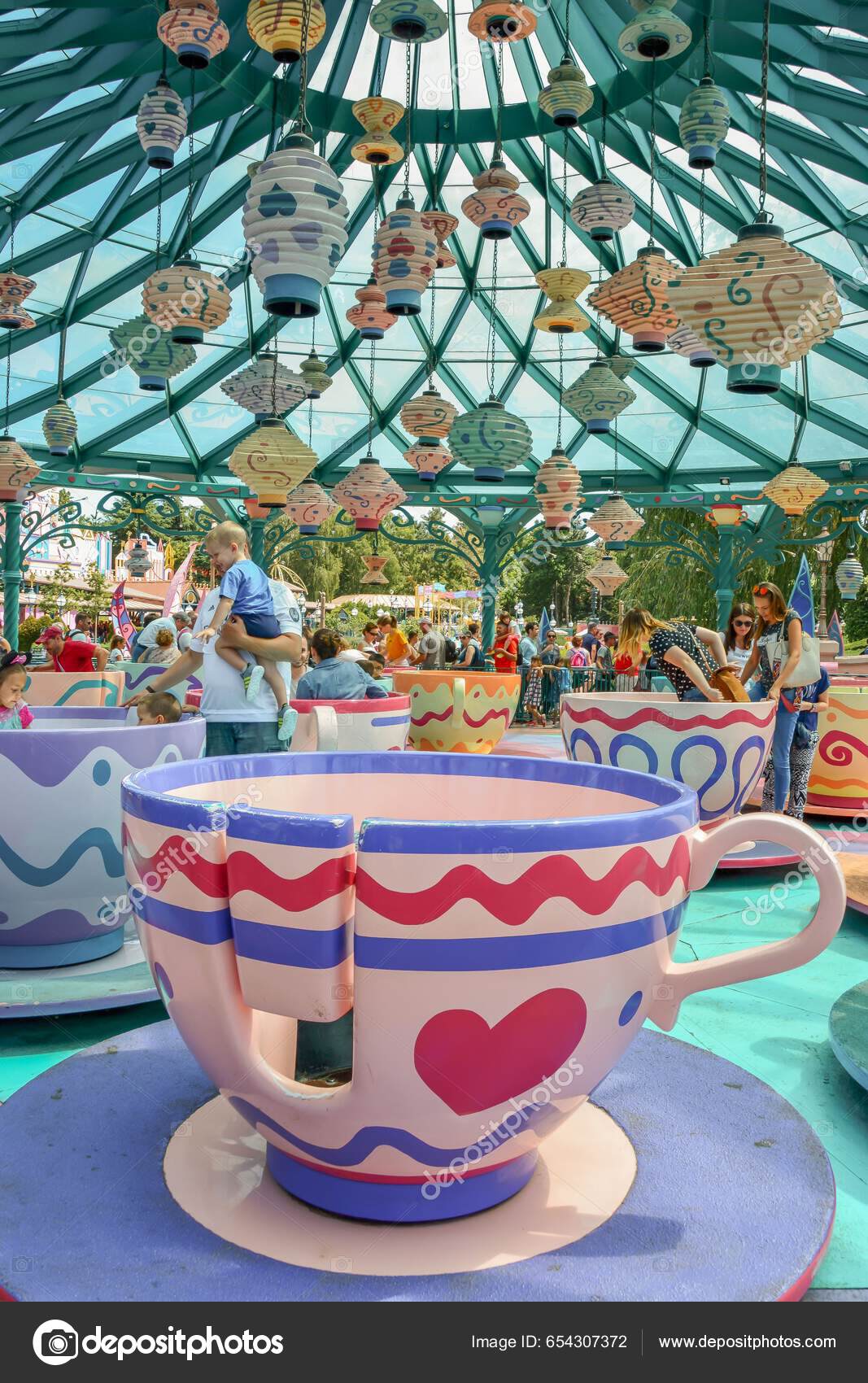 Beautiful Shot People Enjoying Mad Hatter's Tea Cups' Carousel ...