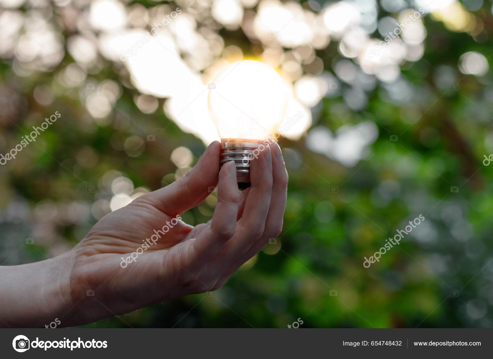 Woman's Hand Holding Lit Lightbulb Bokeh Nature Background Concept Having — Stock Photo ...