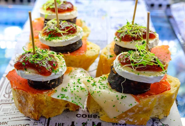 White board with typical snack of Basque Country, pinchos or pinxtos ...