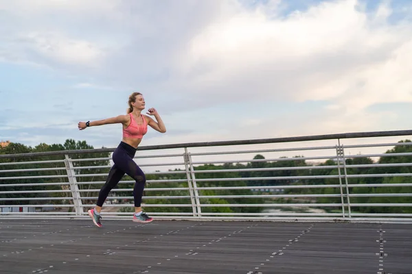 horizontal photo of strong woman running in the city, copy space ...