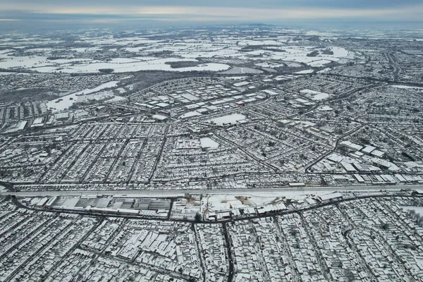 High angle view of Snow covered North Luton's landscape and Cityscape ...
