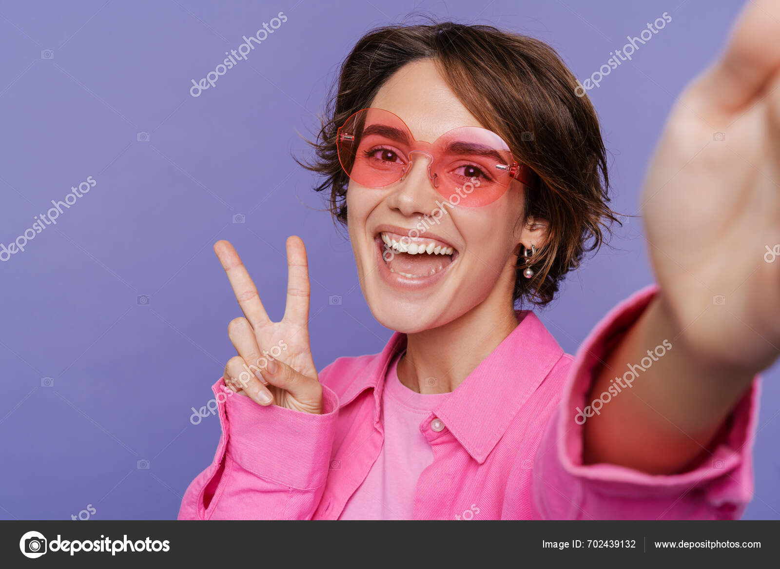Smiling Teen Girl Taking Selfie Showing Peace Sign Two Fingers — Stock Photo © TriangleProd ...