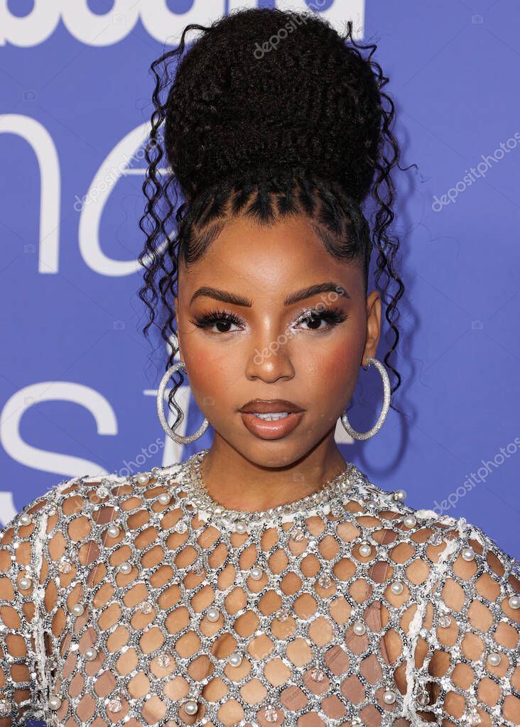 Chloe Bailey wearing a Giambattista Valli dress and Jacob and Co ...