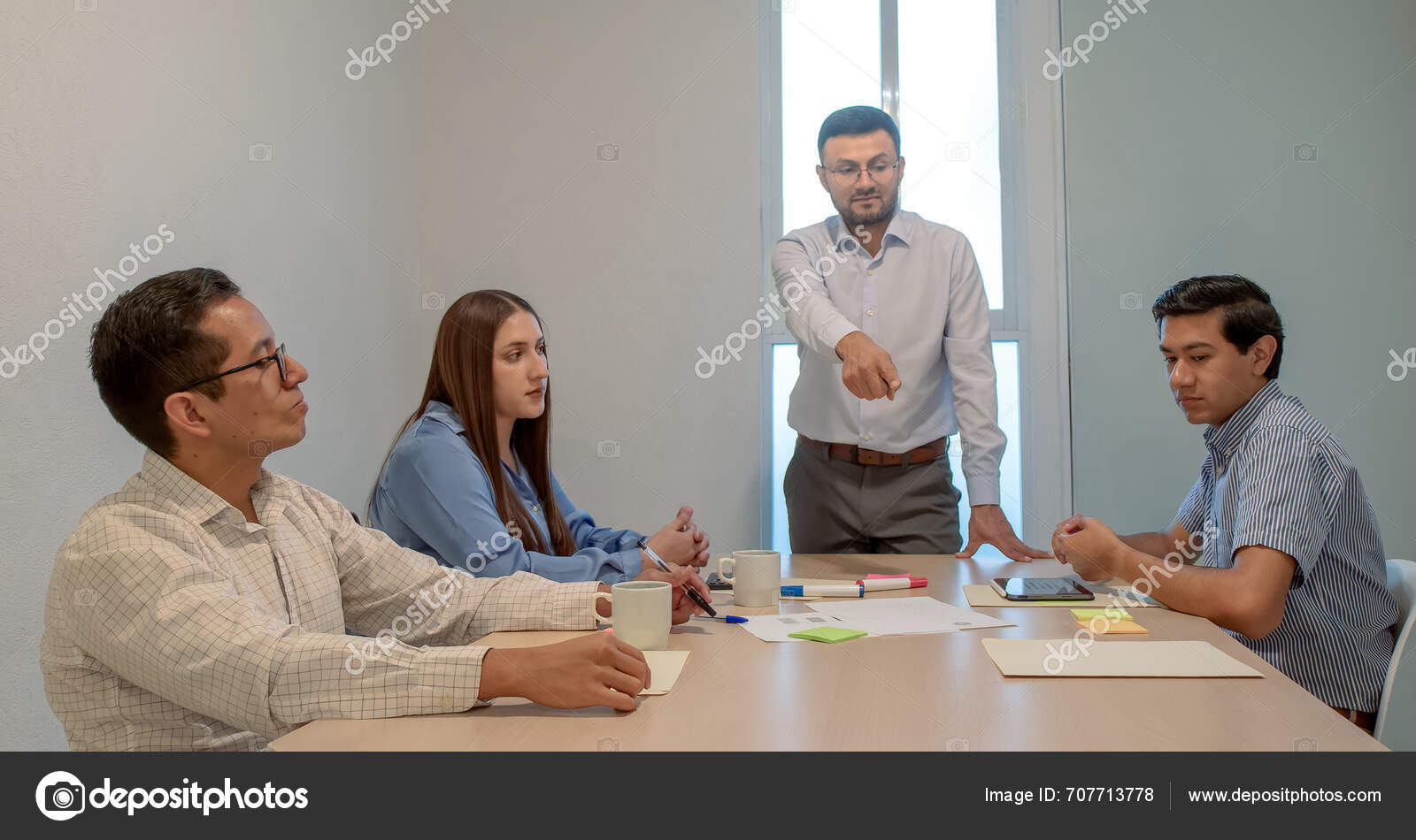Man Pointing Man Front Group People Sitting Table — Stock Photo ...