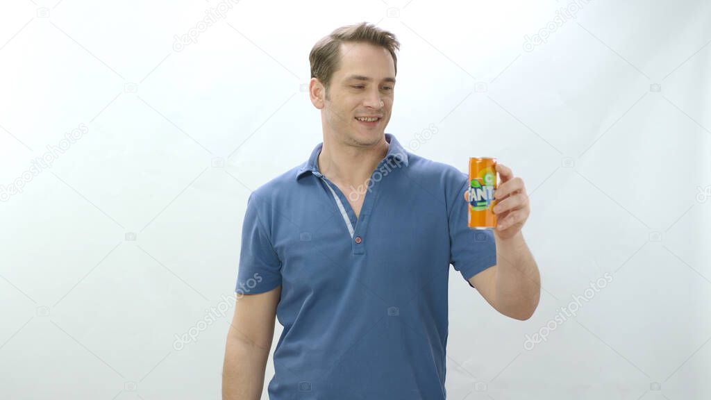 Istanbul,Turkey-04.22.2022:Man drinks carbonated beverage from metal ...
