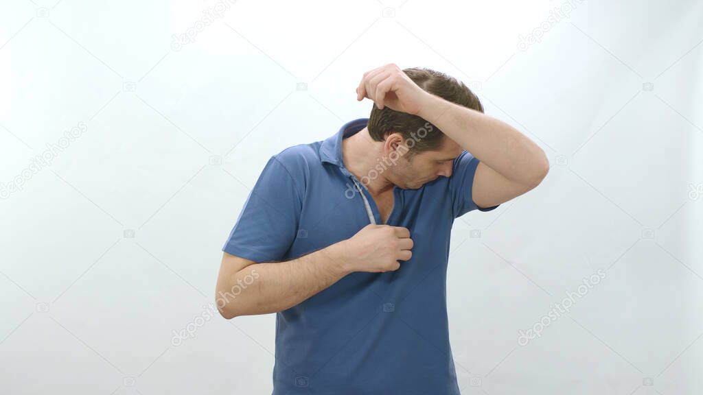 Man who is sweating heavily isolated on white background smells bad ...