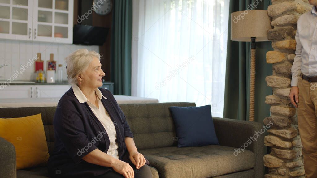 The thoughtful old woman was at home alone in thought. Loneliness grief ...