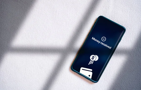 Top view of smartphone transfering money online on screen. Concept of ...