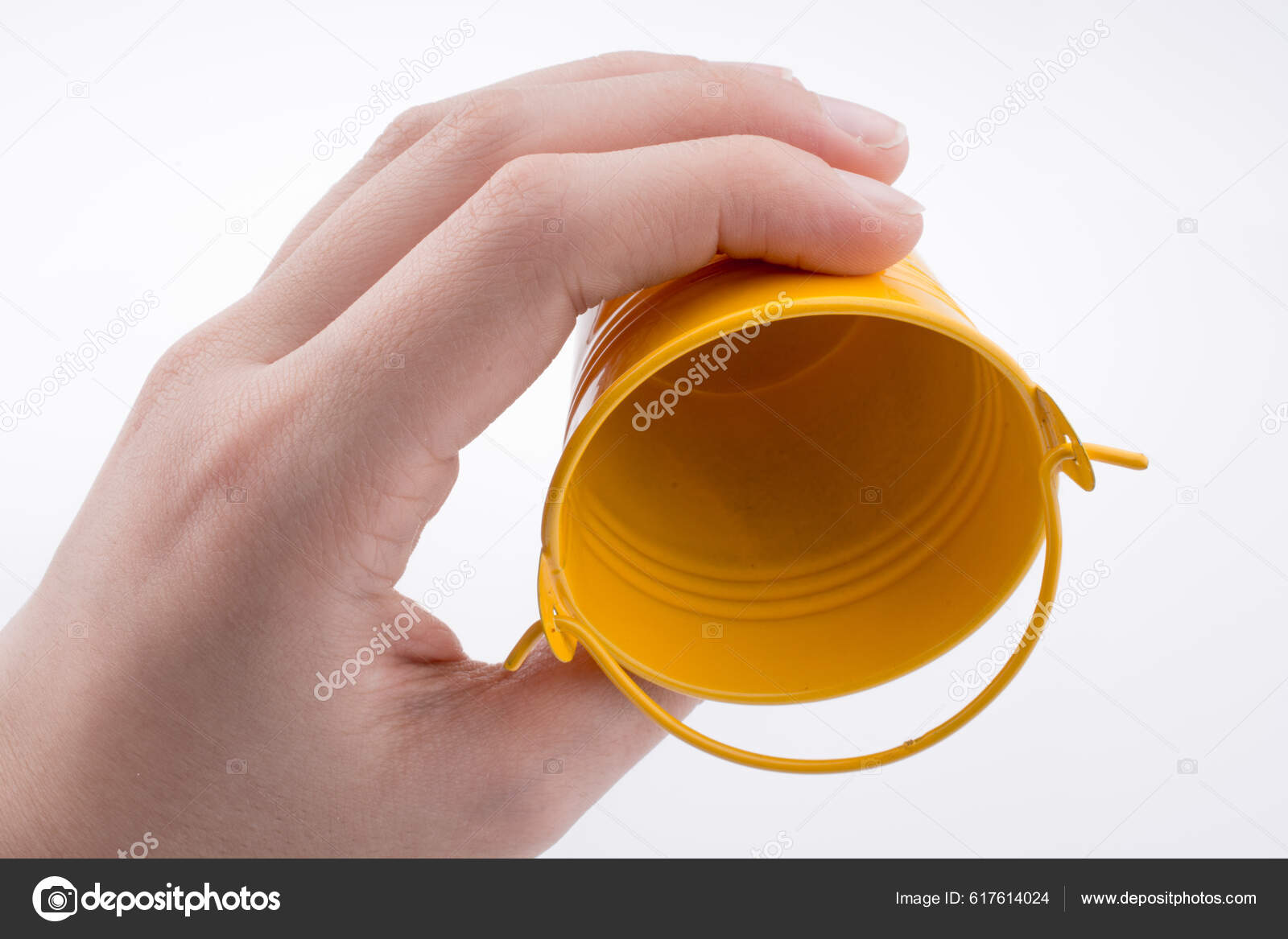 Hand Holding Bucket White Background Stock Photo by ©YAY_Images 617614024