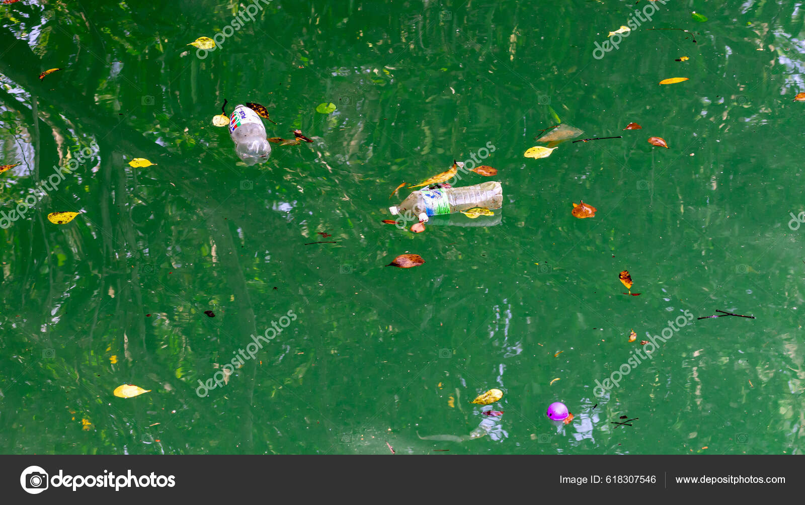 Bottled Waters While Floating River Polluting Waters Stock Photo by ...