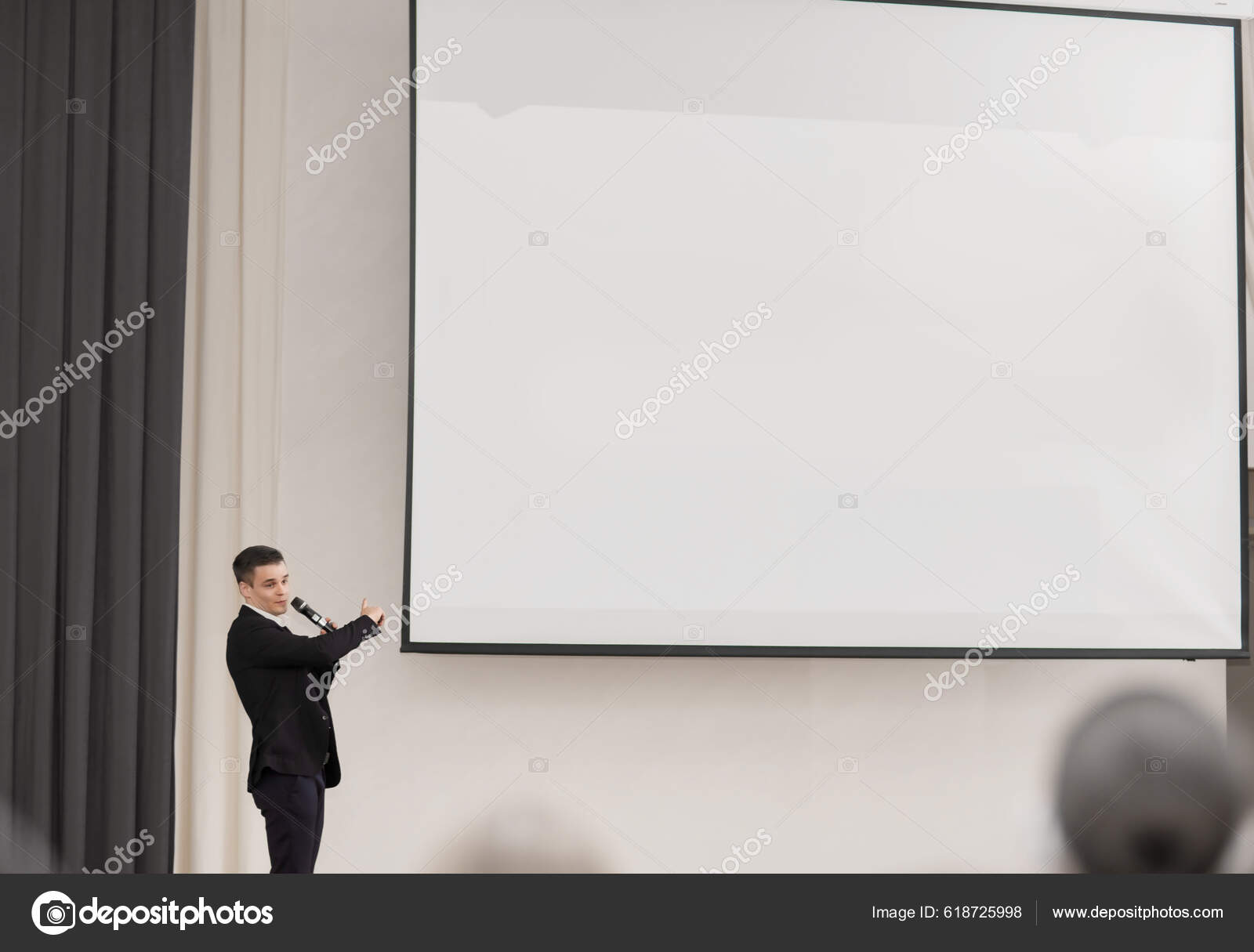 Speaker Conducts Business Conference Standing Front Large White Screen ...