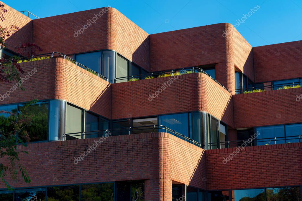 Terrace style building with block design and many balconies made of ...