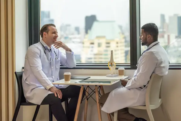 Group of diverse, experienced doctors from different of filed gathering ...