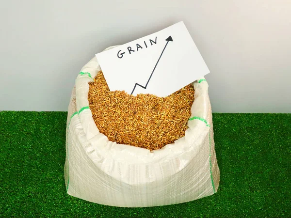 Grain sack with rising grain stock exchange price label due to the ...