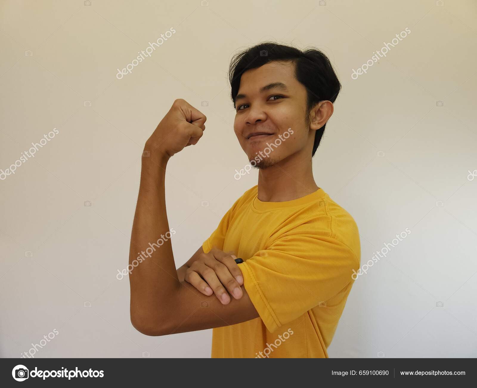 Asian Man Strong Gesture Hold His Arm Muscle — Stock Photo © lucky ...