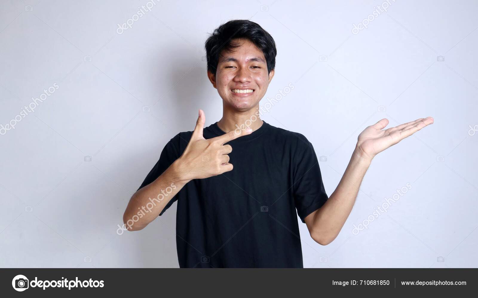 Young Asian Man Smiling Gesturing Right Hand Pointing Left Palm — Stock ...