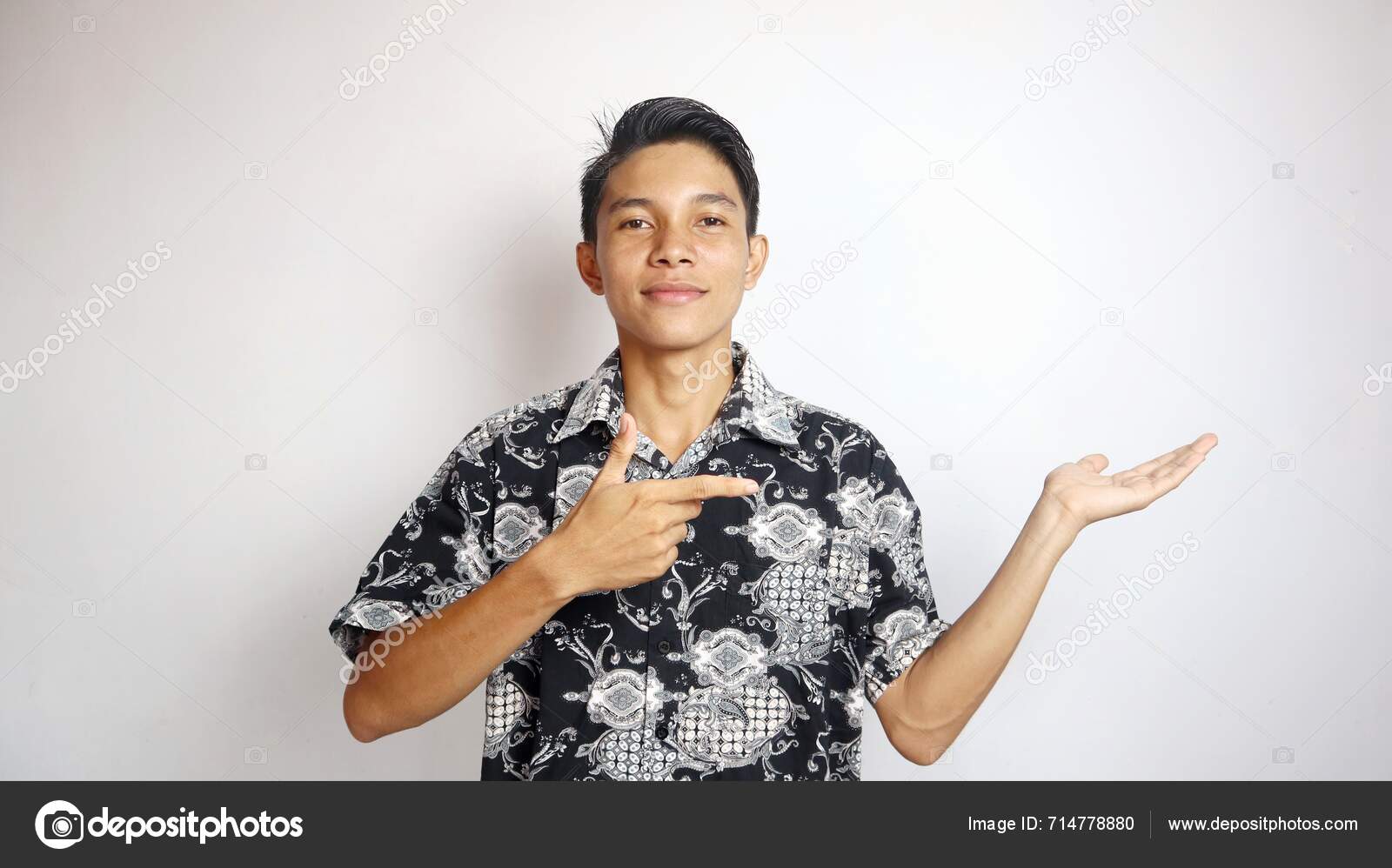 Happy Young Handsome Asian Man Wearing Batik Shirt Posing Pointing ...