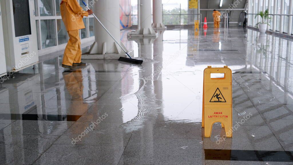 Yellow caution wet floor sign at MRT station - Image of danger ...