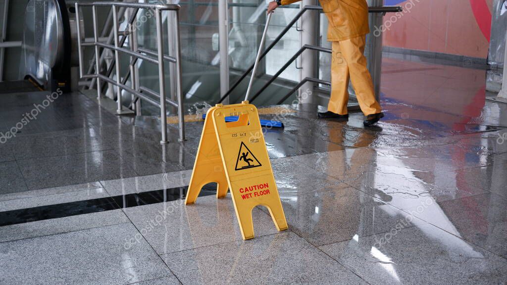 Yellow caution wet floor sign at MRT station - Image of danger ...