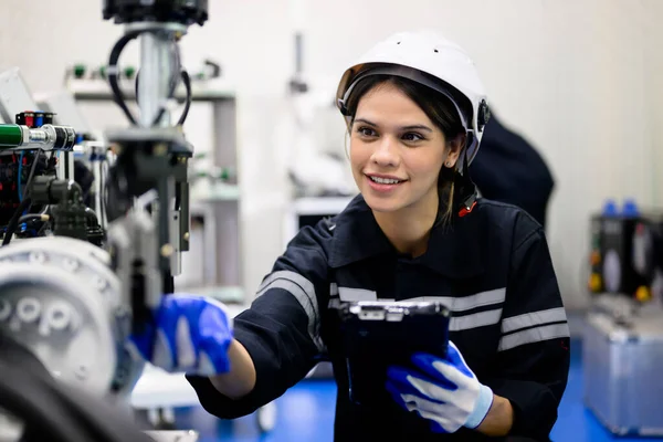 Smiling portrait of female technician engineer checking and repairing ...