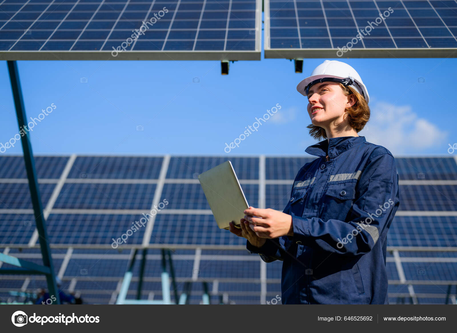 Female Engineer Holding Laptop Checking Solar Panels Industrial Solar ...