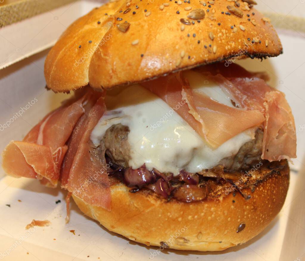 double cheeseburger with fries in the shape of a smiley face. Hamburger ...