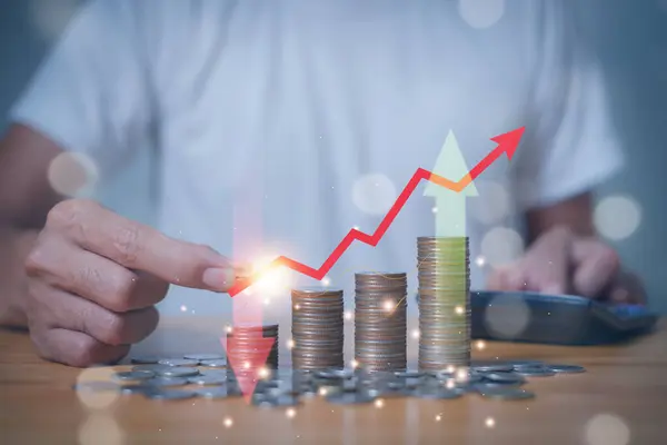 Businessman stacking money coins with up arrow and percentage symbol ...
