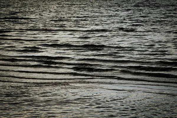 Dark ominous sea water with waves. Soft selective focus. Artificially ...