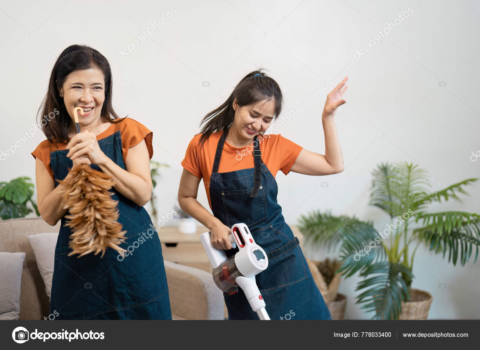 Two Housekeepers Enjoy Cleaning Modern Home Showcasing Effective ...