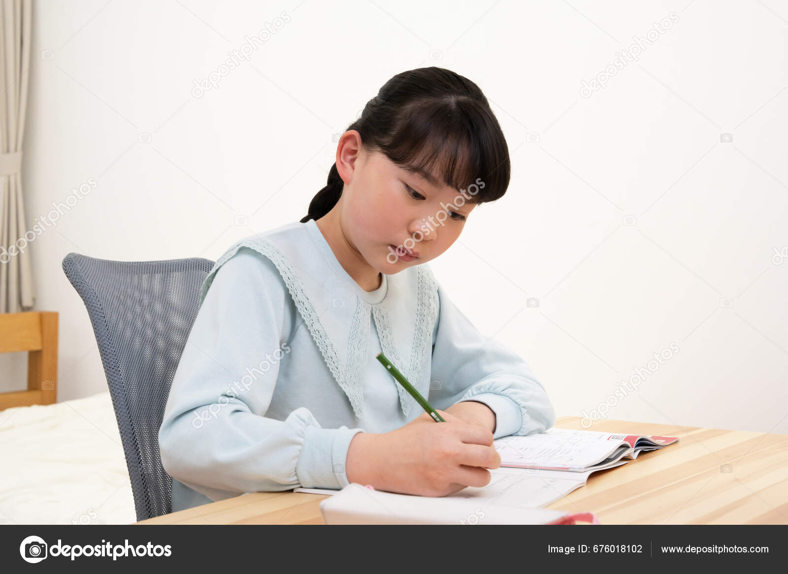 Young Asian Child Studying — Stock Photo © Paylessimages #676018102