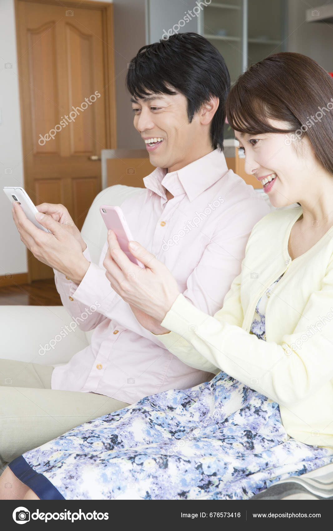 Young Couple Using Smart Mobile Phones Home — Stock Photo ...