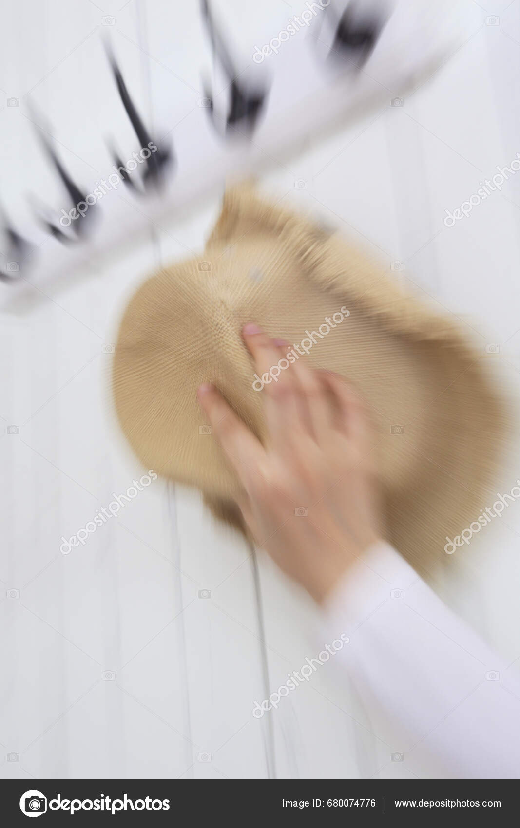Young Man's Hand Putting Hat Hook — Stock Photo © Paylessimages #680074776
